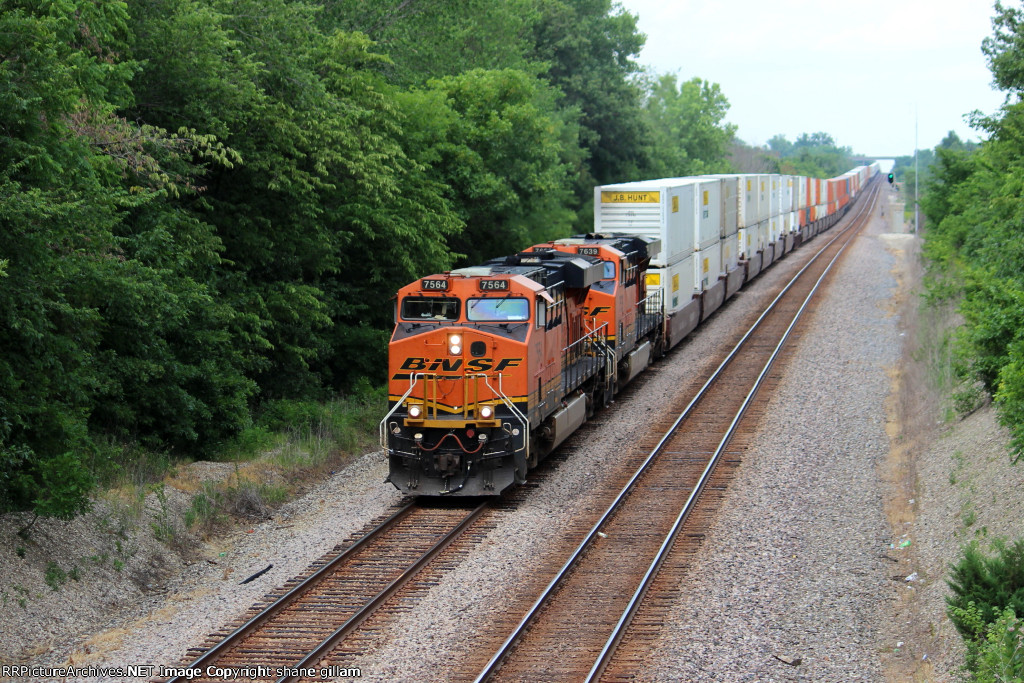 BNSF 7564 leads a wb stack train.